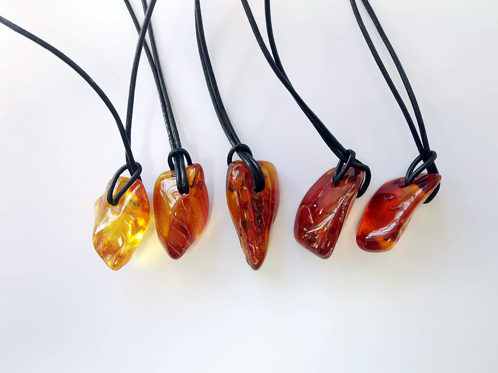 A beautiful leather adult health necklace with Baltic amber stone.
