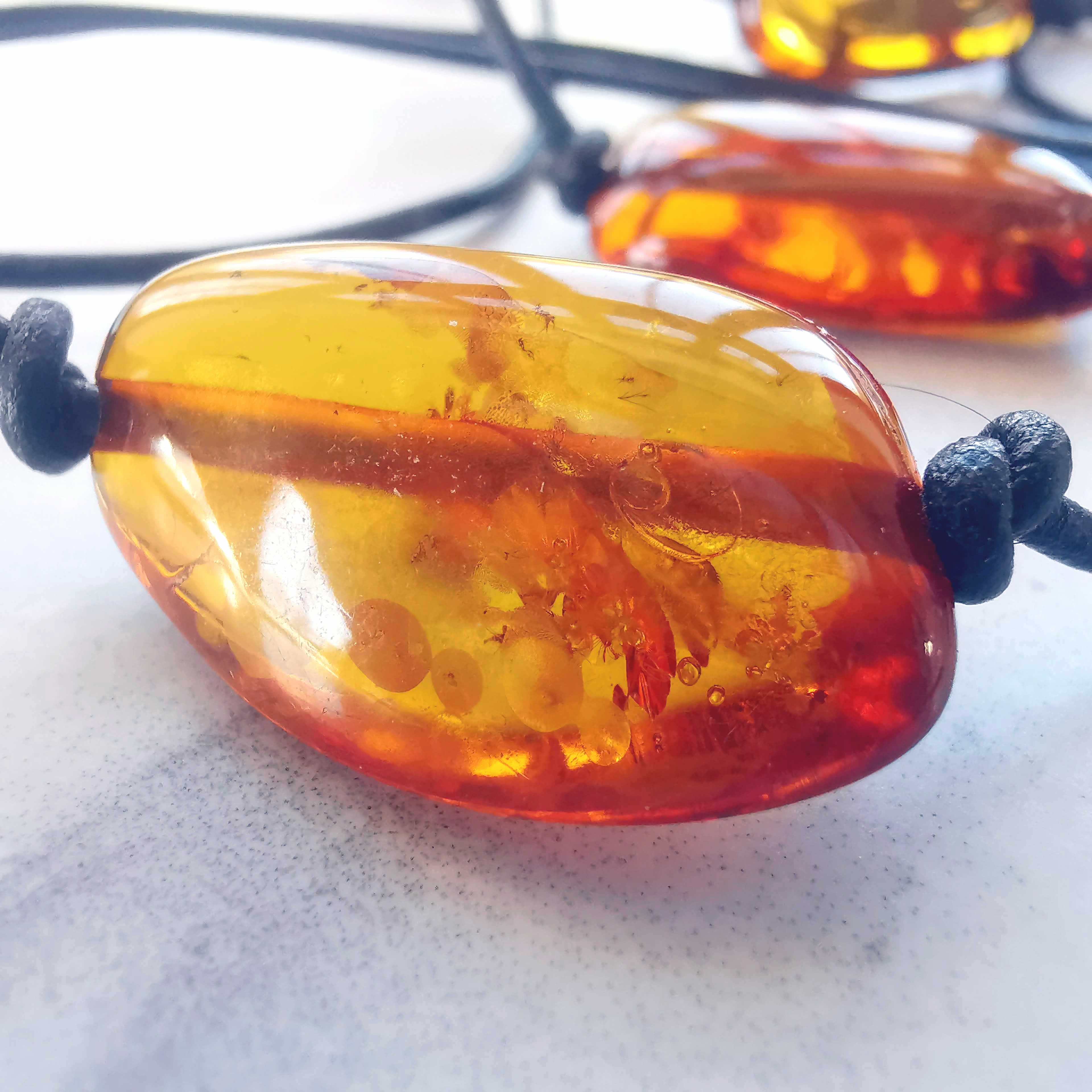 A beautiful leather adult bracelet with Baltic amber stone.